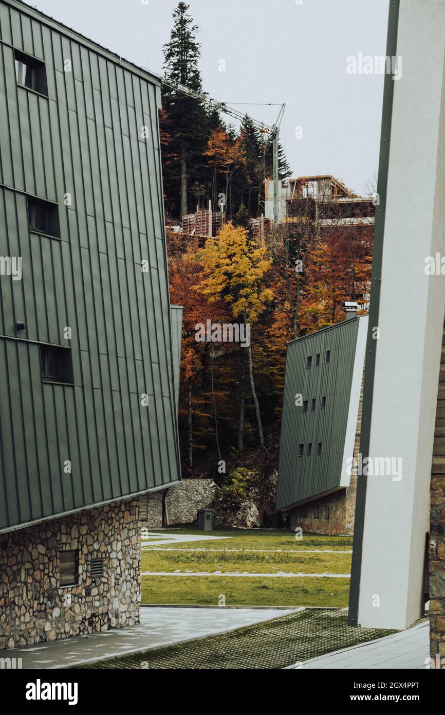 Vertical shot of a building with colorful fall trees Stock Photo - Alamy