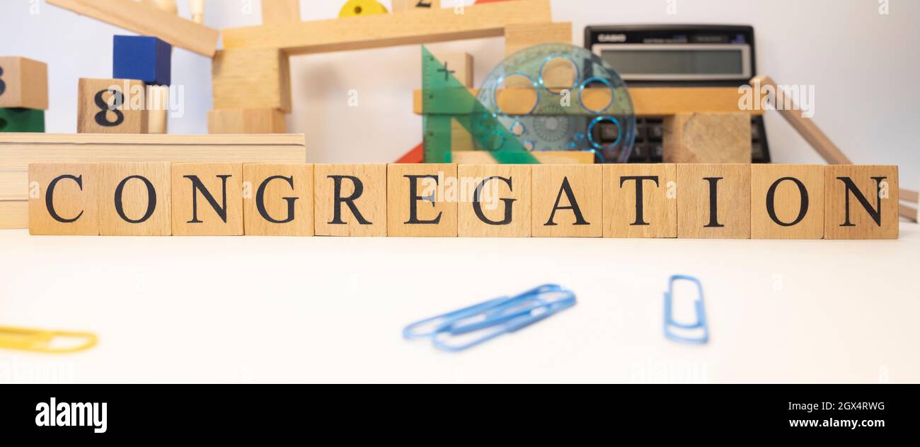 The word congregation was created from wooden cubes. close up Stock ...