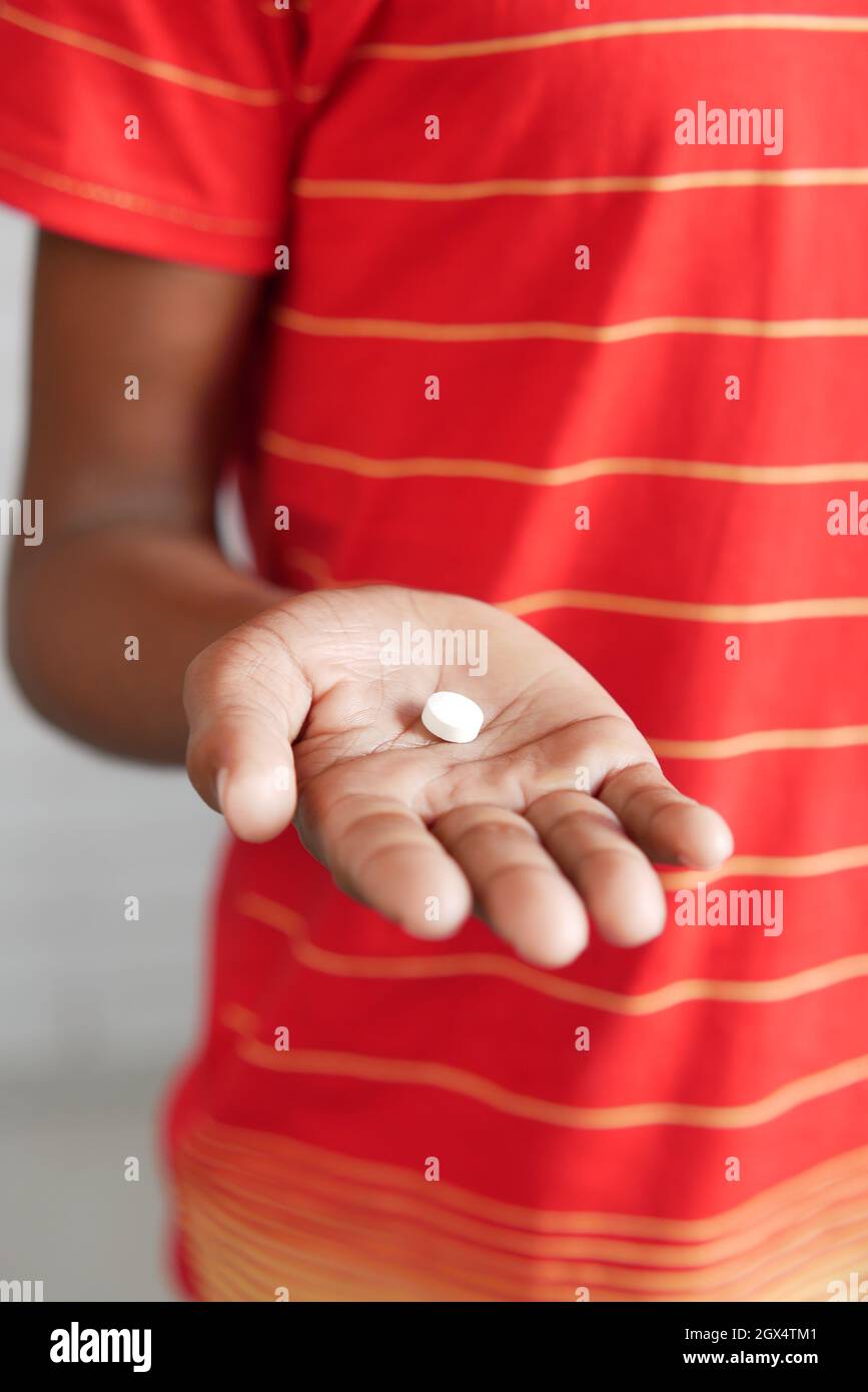 Child taking pills hi-res stock photography and images - Alamy