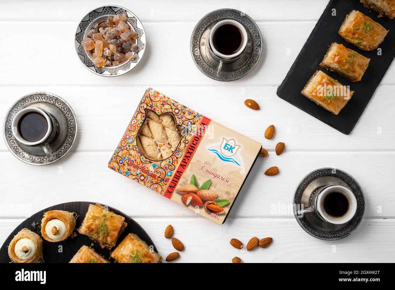 Top view of Turkish sweets and Turkish coffee on white wooden ...
