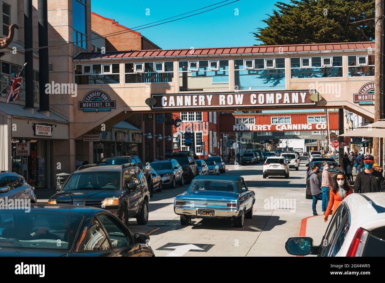 an old sign for 'Cannery Row Company' and 'Monterey Canning Co' mounted ...