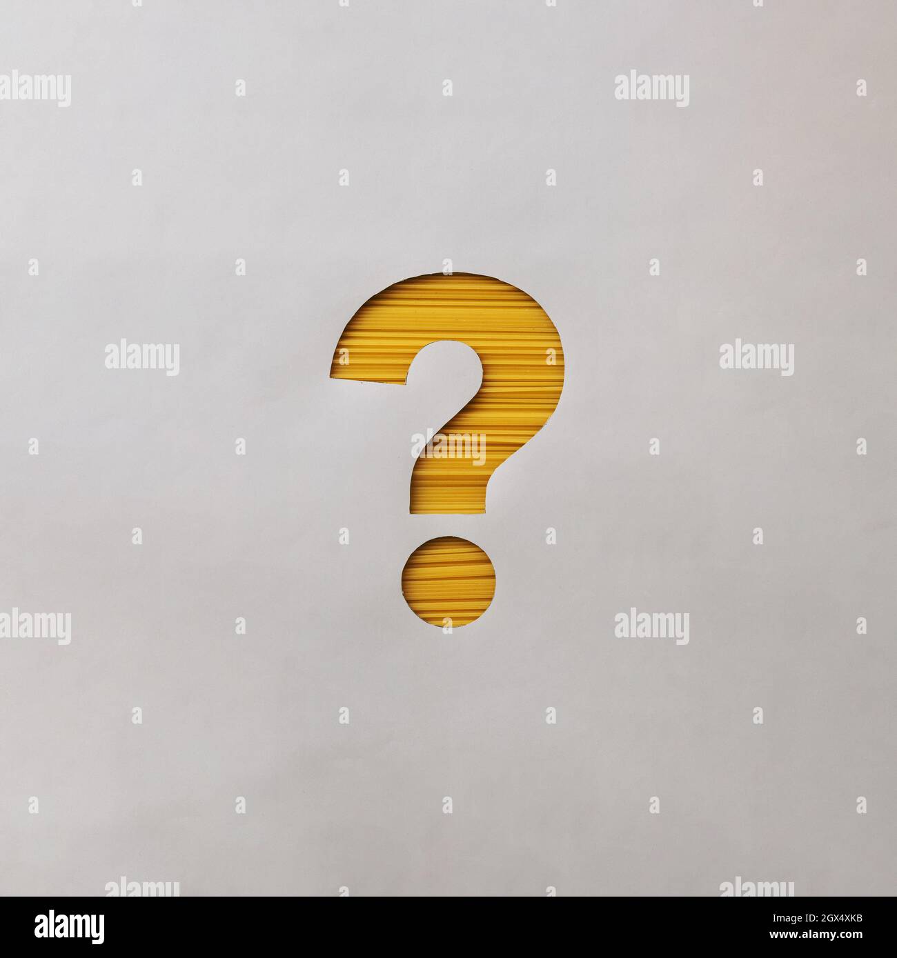 Creative minimal question mark symbol with yellow spaghetti concept of ...