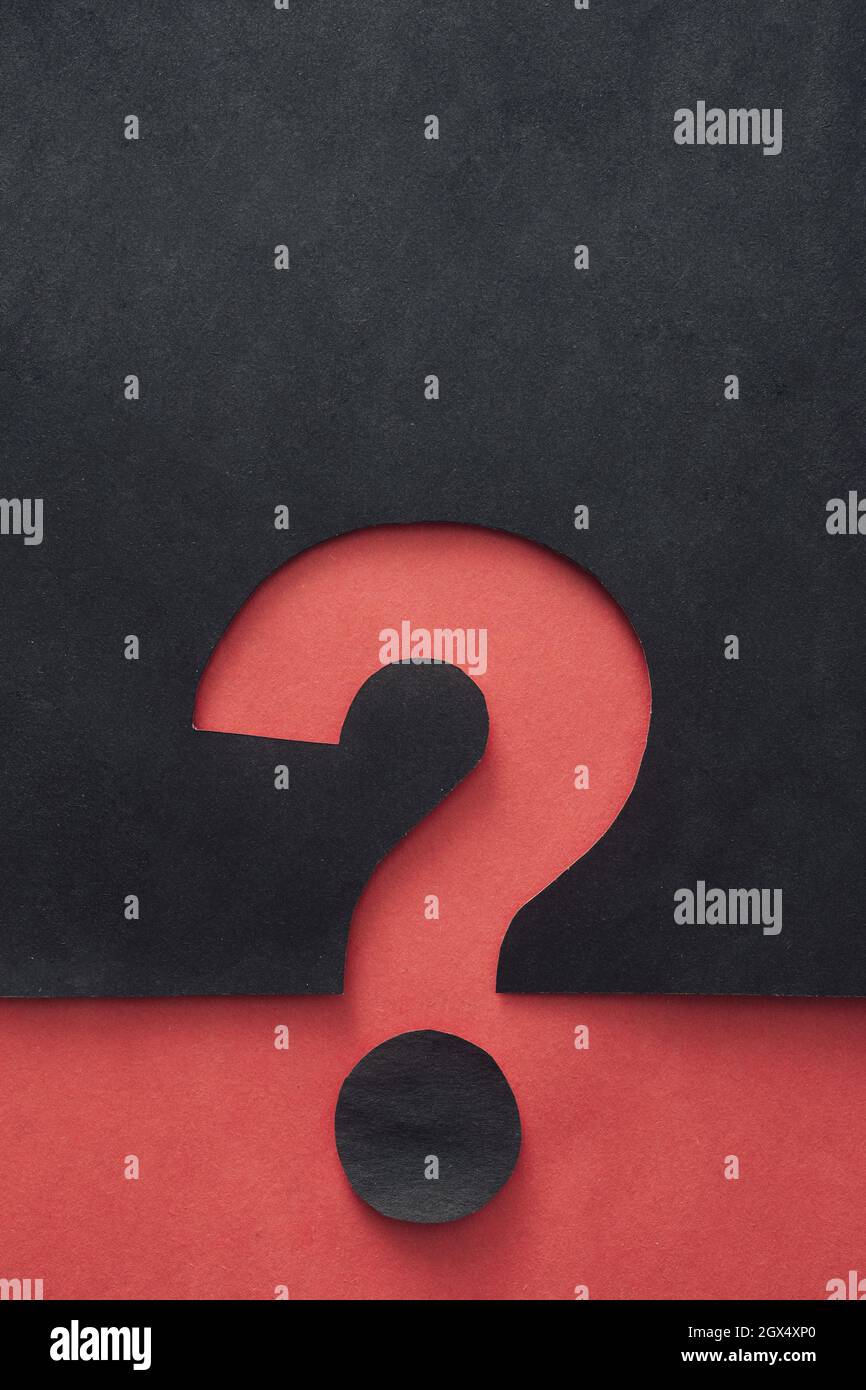 Creative bicolor background with red and black question mark cutout and ...