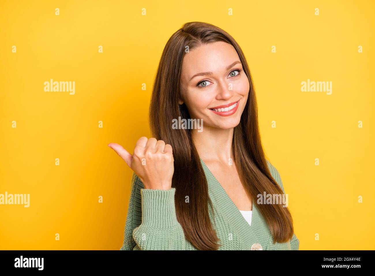 Pointing behind with her thumb hi-res stock photography and images - Alamy