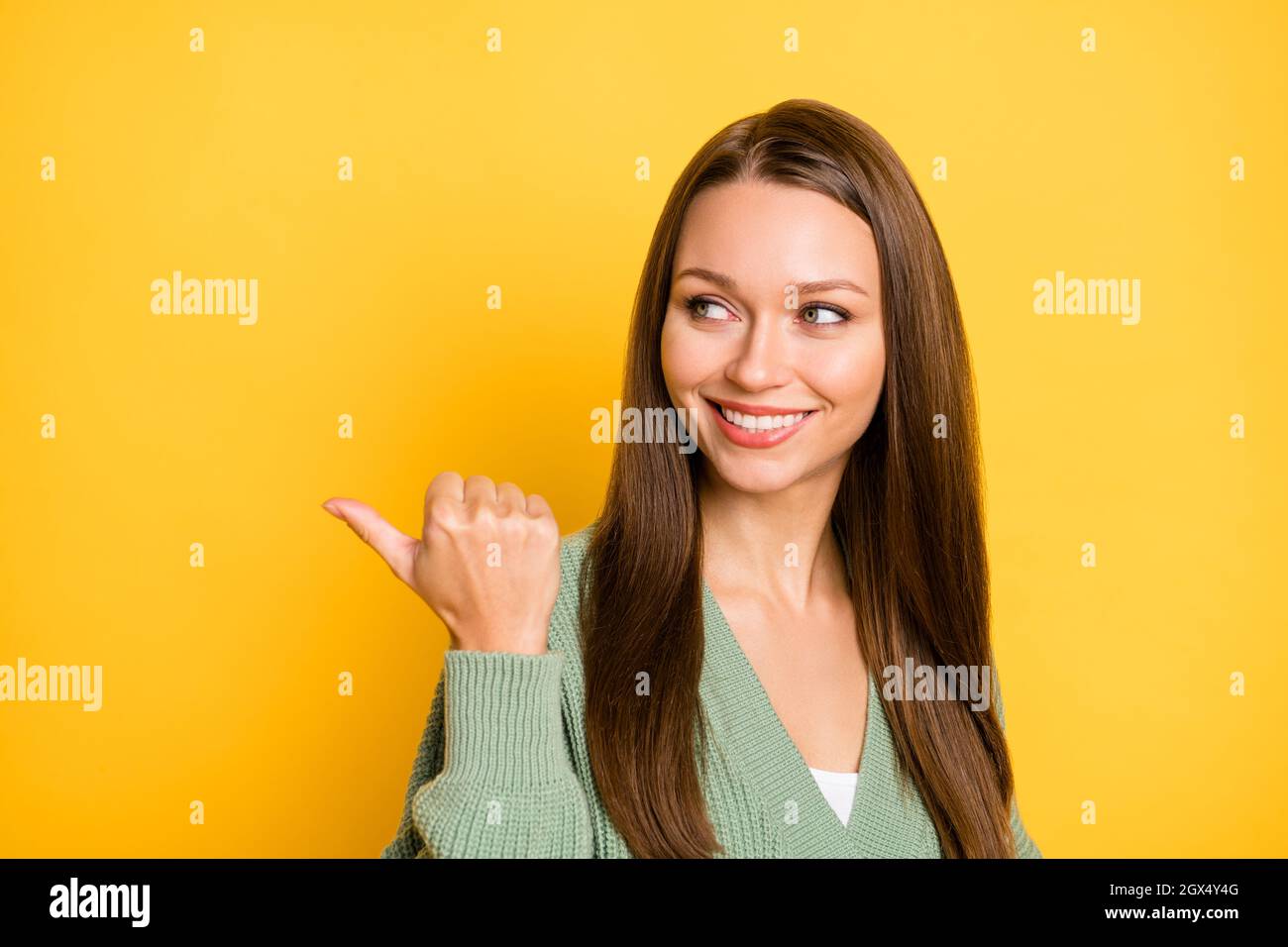 Pointing behind with her thumb hi-res stock photography and images - Alamy