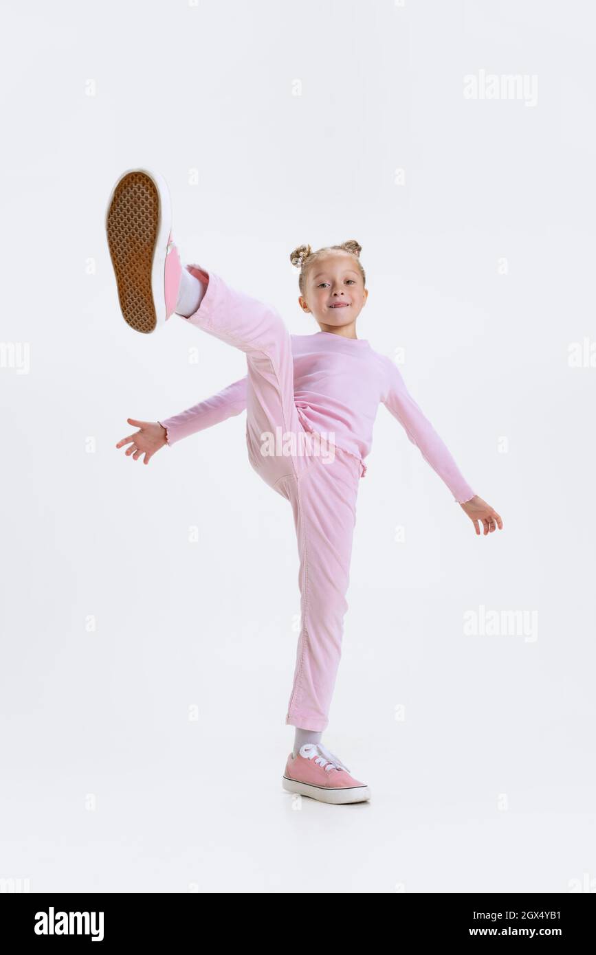 Bottom view. Portrait of little active Caucasian preschool girl ...