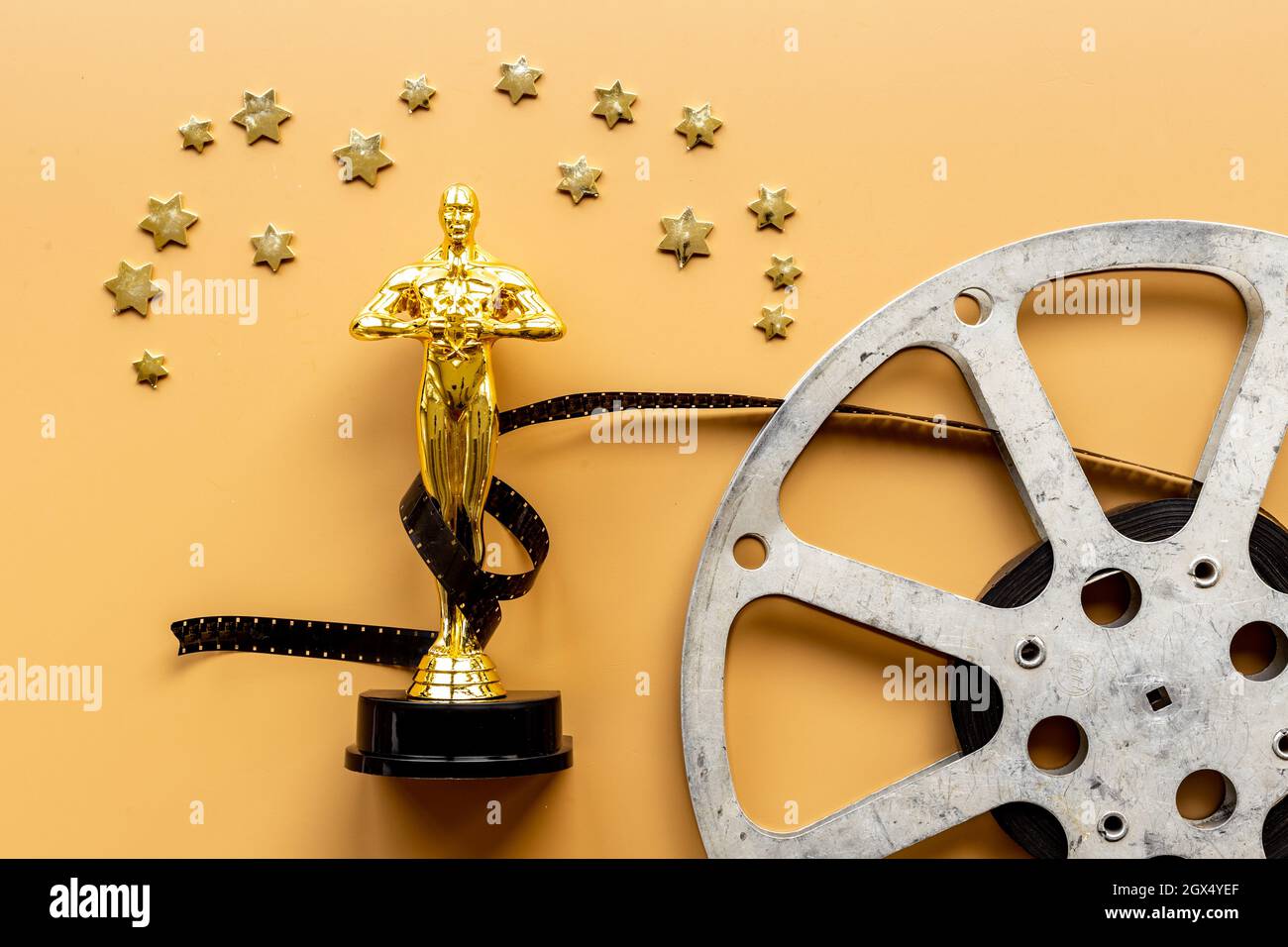 Golden movie award statue with stars - best film winner Stock Photo - Alamy