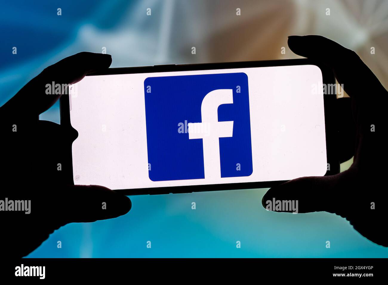 In this photo illustration a Facebook logo seen displayed on a ...