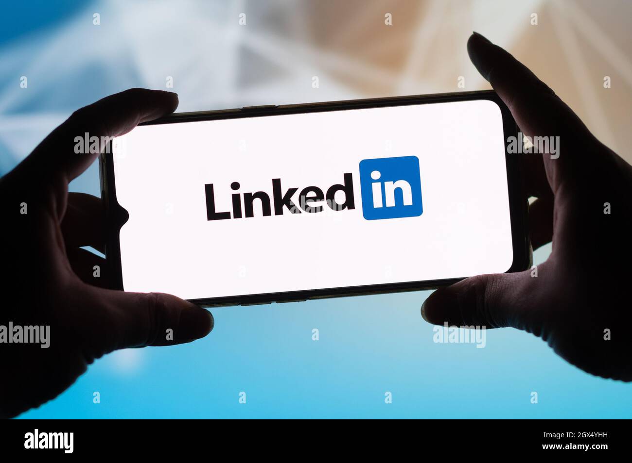 In this photo illustration a LinkedIn logo seen displayed on a ...