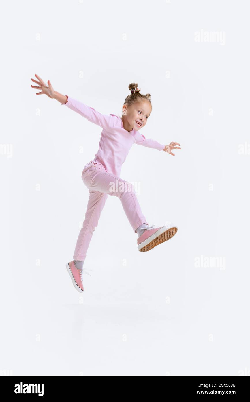 Bottom view. Portrait of little active Caucasian preschool girl ...