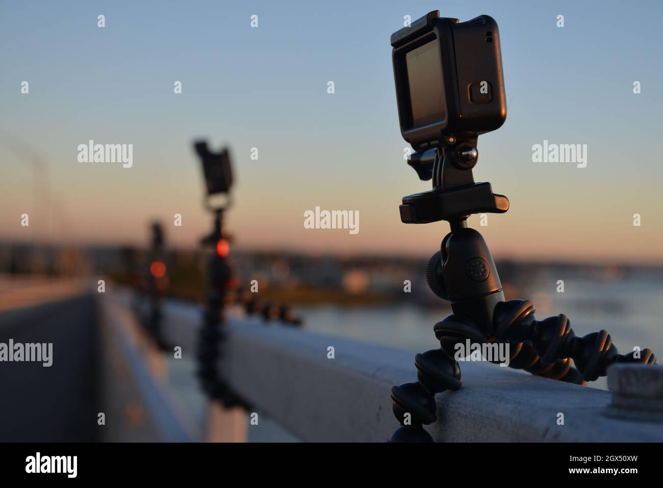 Silhouette of stabilized cameras shooting the sunrise on the beach ...