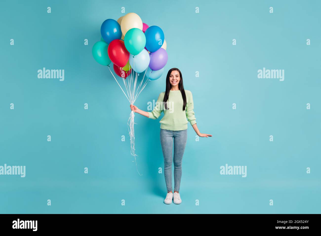 Full Size Photo Of Young Happy Cheerful Good Mood Girl Hold Balloons