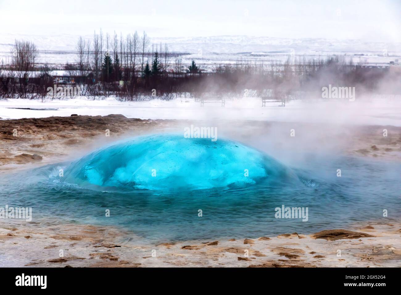 The famous Strokkur geyser erupting. Southwest Iceland. A blue bubble ...