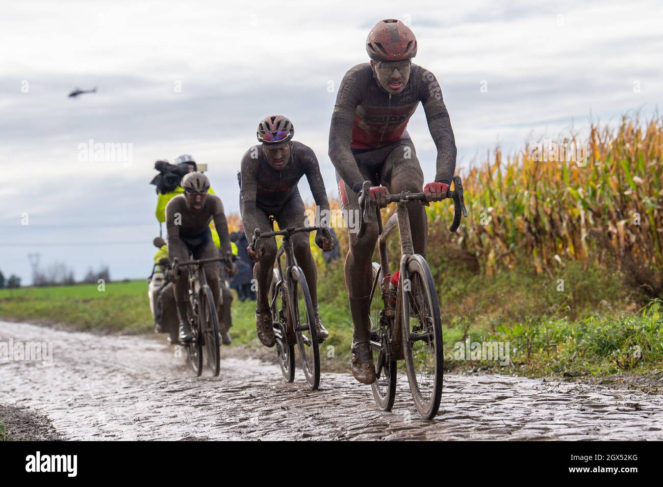 Florian Vermeersch leads Gianni Moscon and Tom Van Asbroeck across a ...