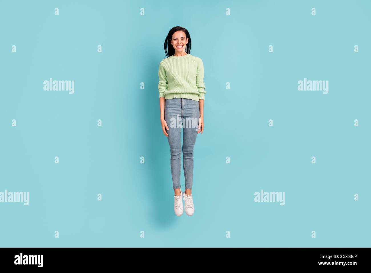 Full length body size view of pretty slender glad cheerful girl jumping ...