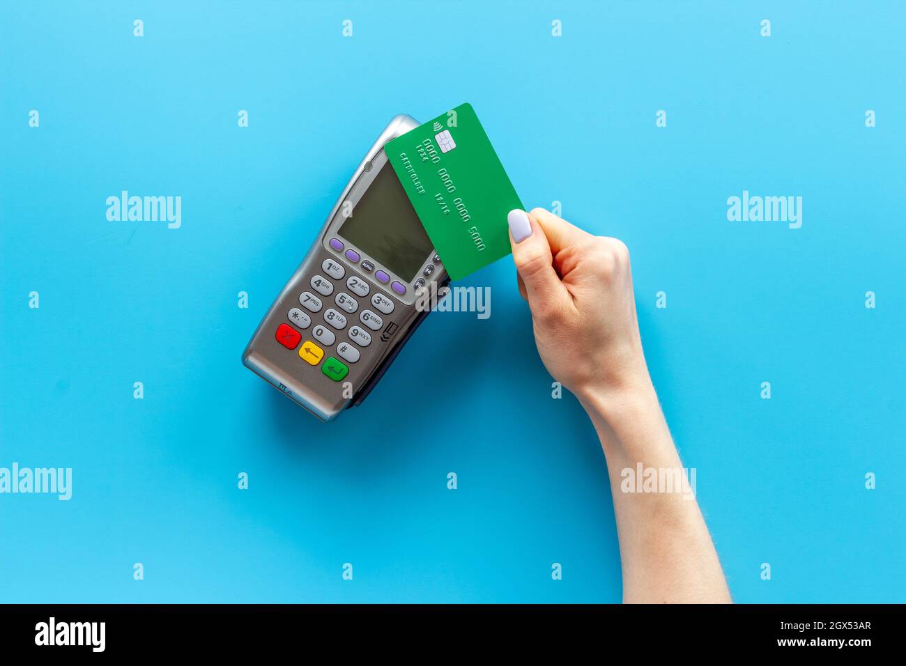 Hand swiping credit card by pos terminal. Payment transactions concept ...