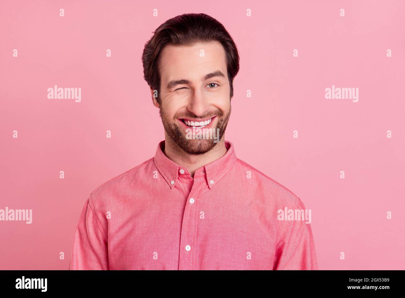 Portrait of attractive positive flirty cheerful guy winking isolated ...