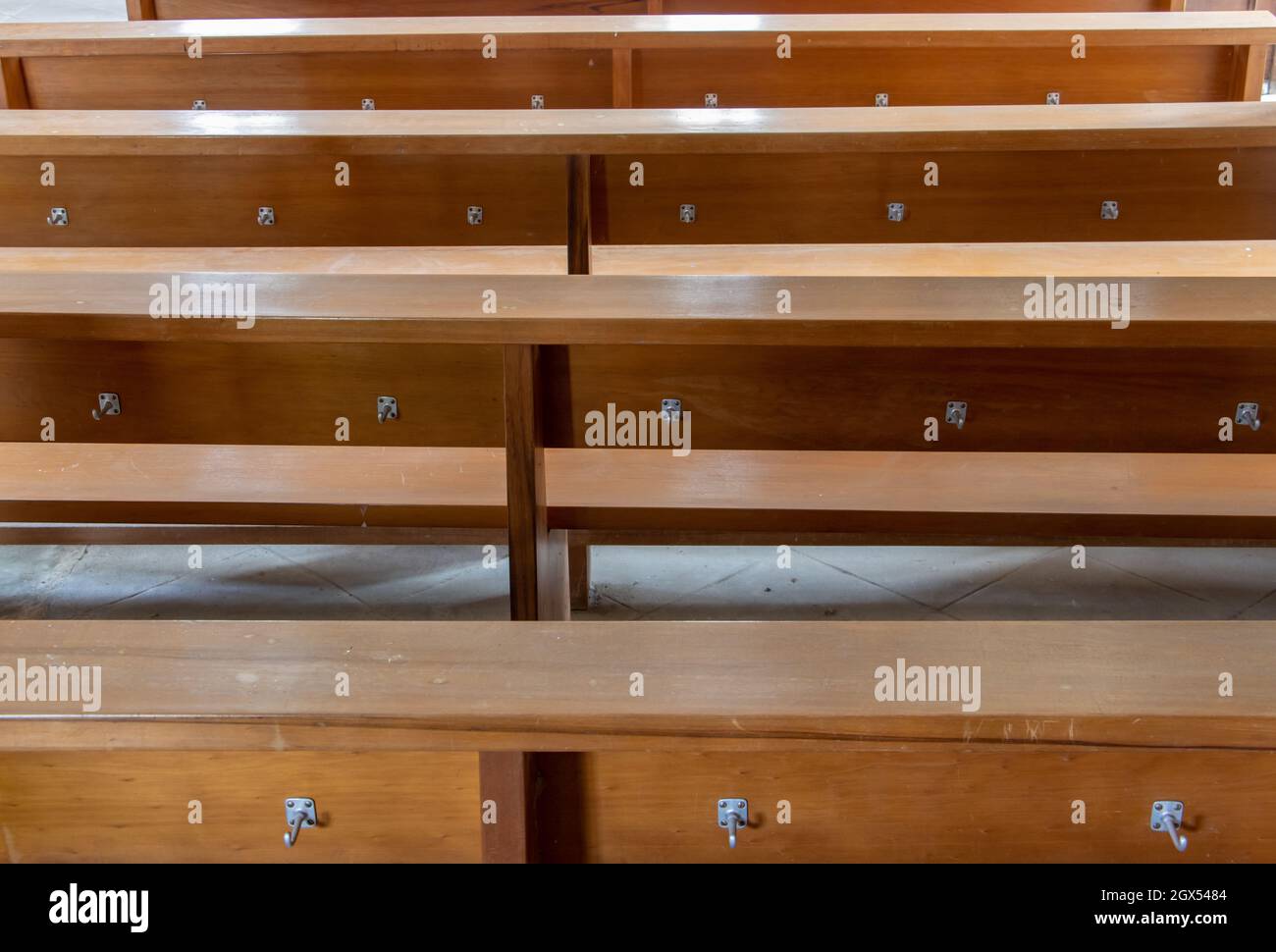 A empty pews in the church with hooks on his back side Stock Photo - Alamy