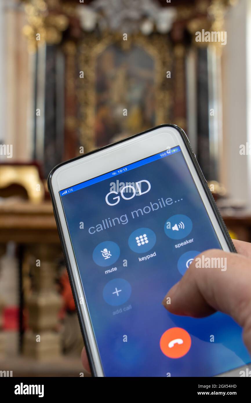 Calling God by mobile phone in front of the altar in the church Stock ...