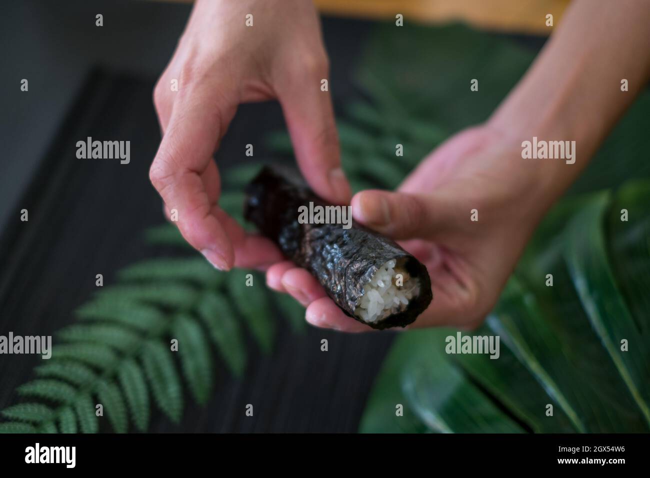 The process of making and decorating tuna Temaki Hand Roll. Hand ...