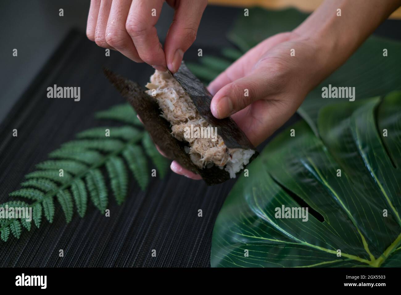 The process of making and decorating tuna Temaki Hand Roll. Hand ...