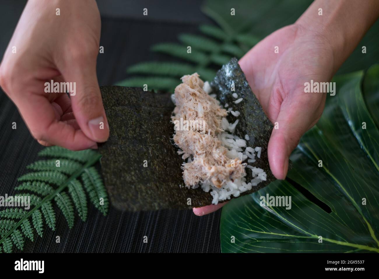 The process of making and decorating tuna Temaki Hand Roll. Hand ...