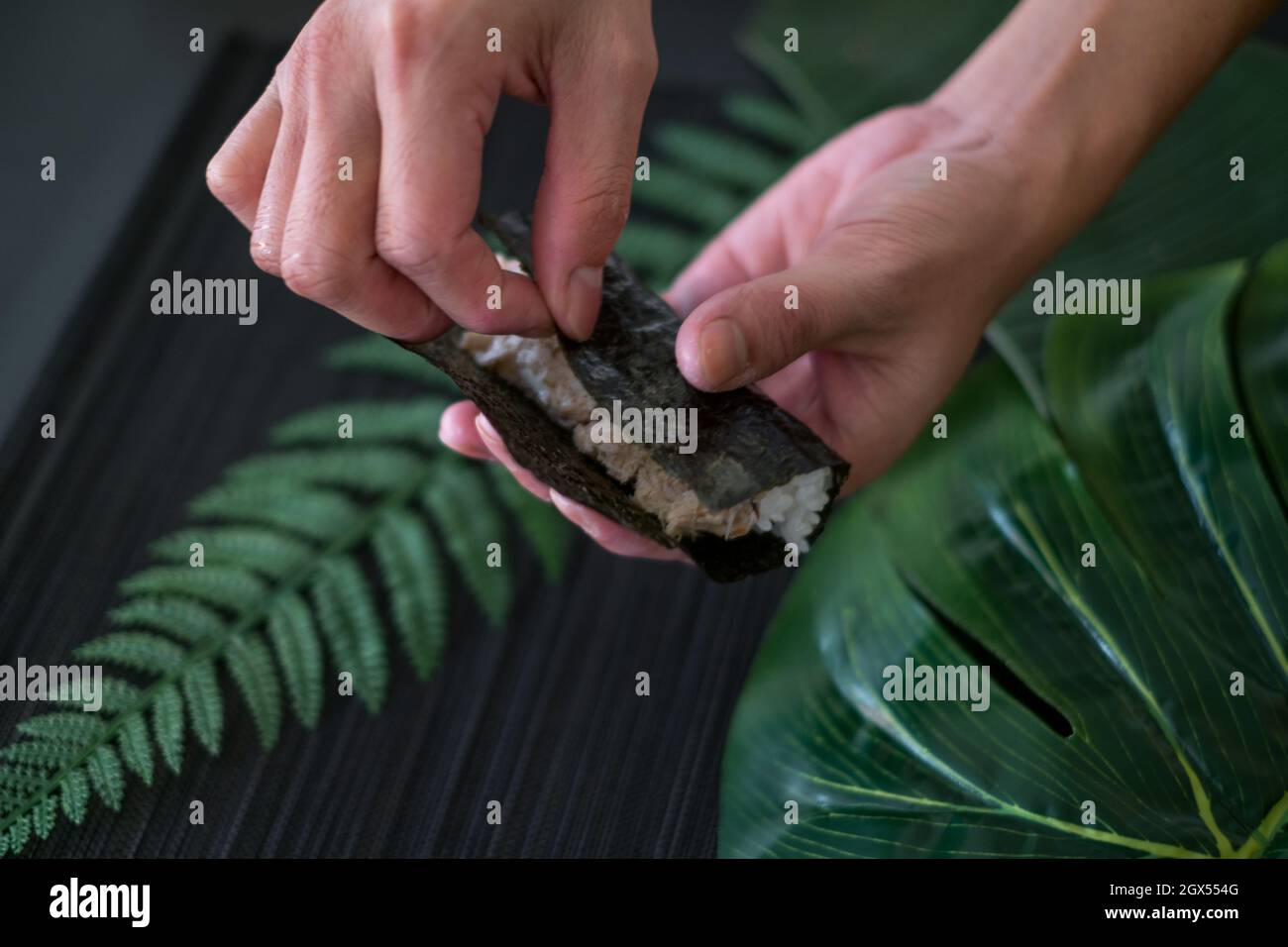 The process of making and decorating tuna Temaki Hand Roll. Hand ...