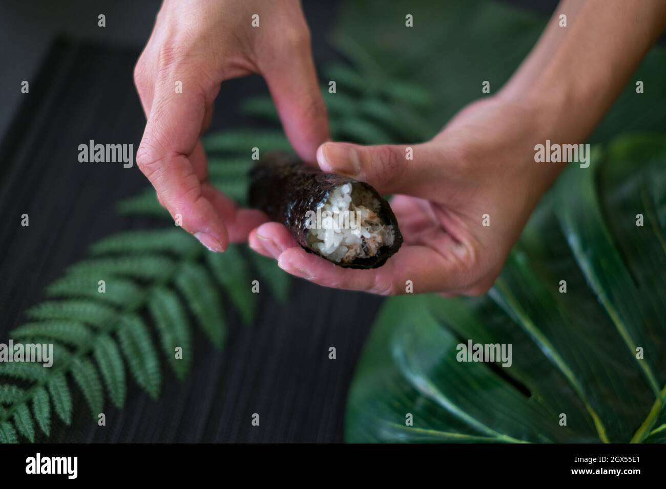 The process of making and decorating tuna Temaki Hand Roll. Hand ...