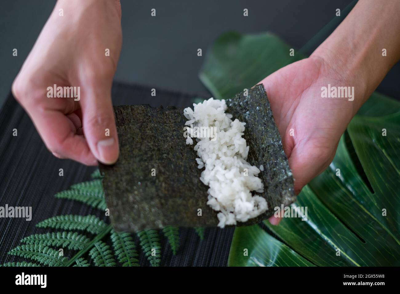 The process of making and decorating tuna Temaki Hand Roll. Hand ...