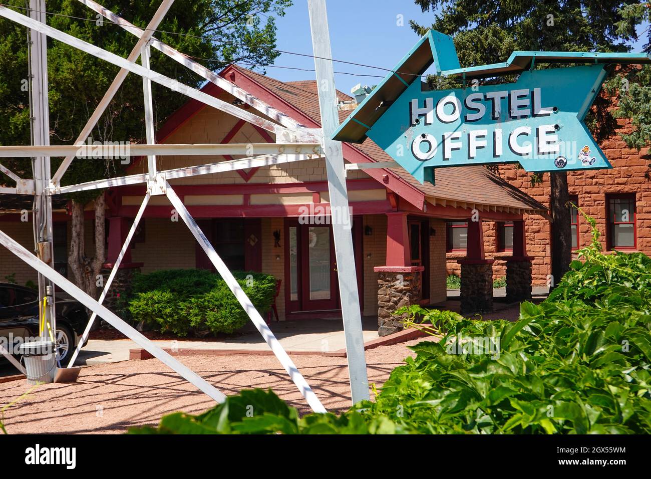 Hostel Office sign at the base of the old Downtowner Motel tower. Most ...