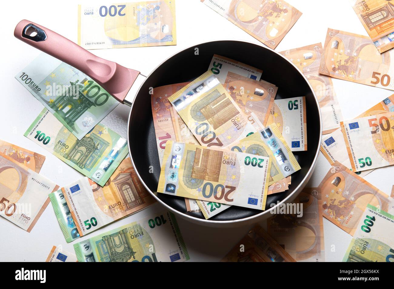 New frying pan with money euro banknotes on a white background Stock ...