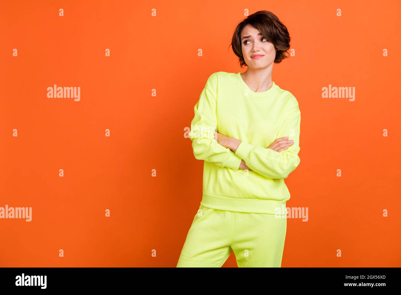 Portrait of attractive arrogant moody girl folded arms looking aside ...