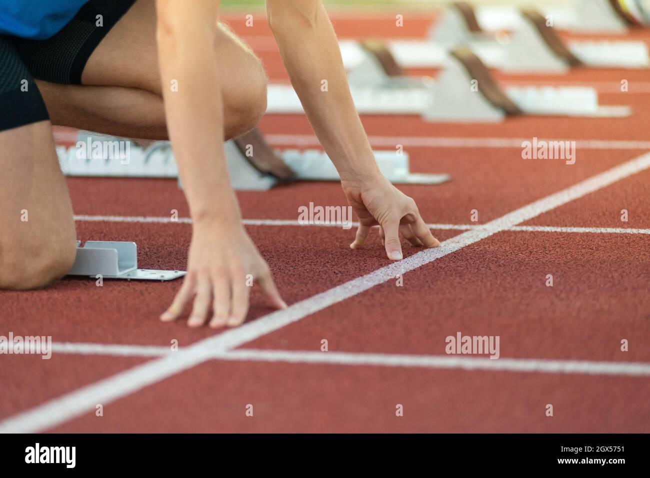 Man on starting blocks hi-res stock photography and images - Alamy