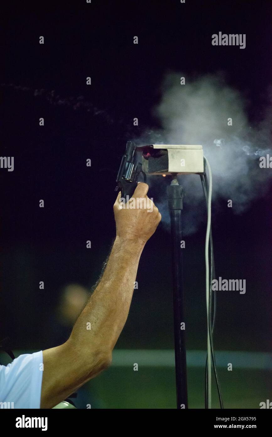 Race Official Firing a Pistol at the Start of a Race Stock Photo - Alamy
