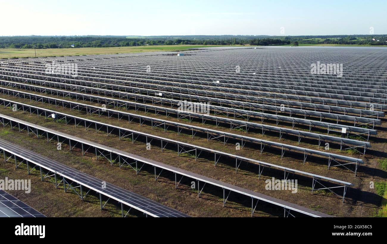 Aerial drone view flight over solar power station panels Stock Photo ...