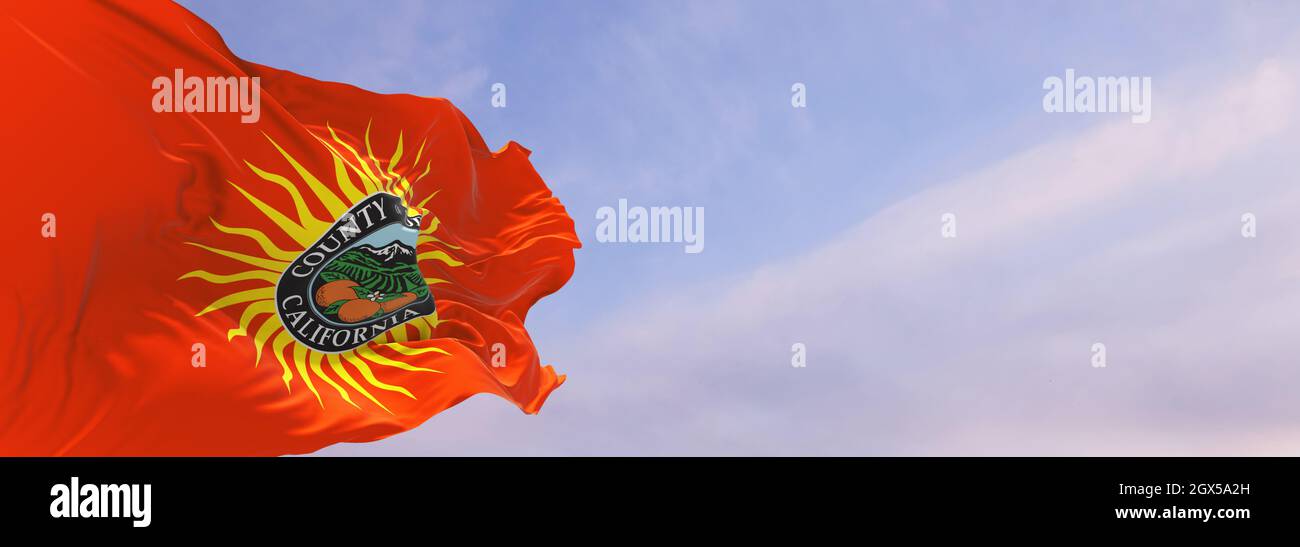flag of county Orange, California , USA at cloudy sky background on ...