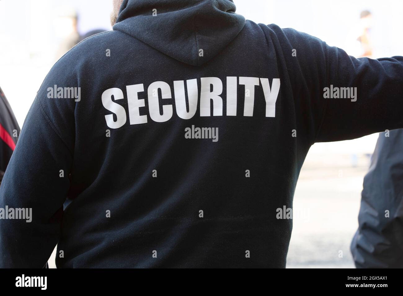 A security guard officer at a public event Stock Photo - Alamy