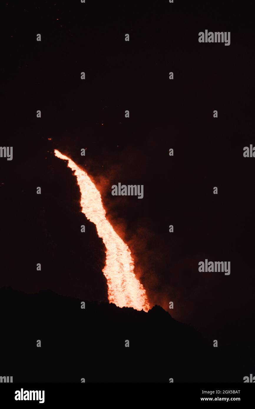 Volcan in eruption with lava by night Stock Photo - Alamy