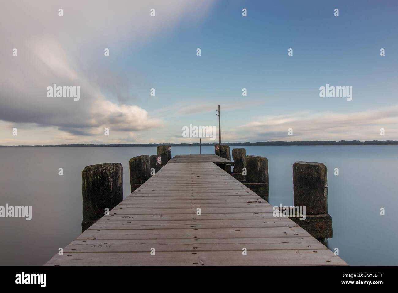 Wooden pier on a deep sea Stock Photo - Alamy