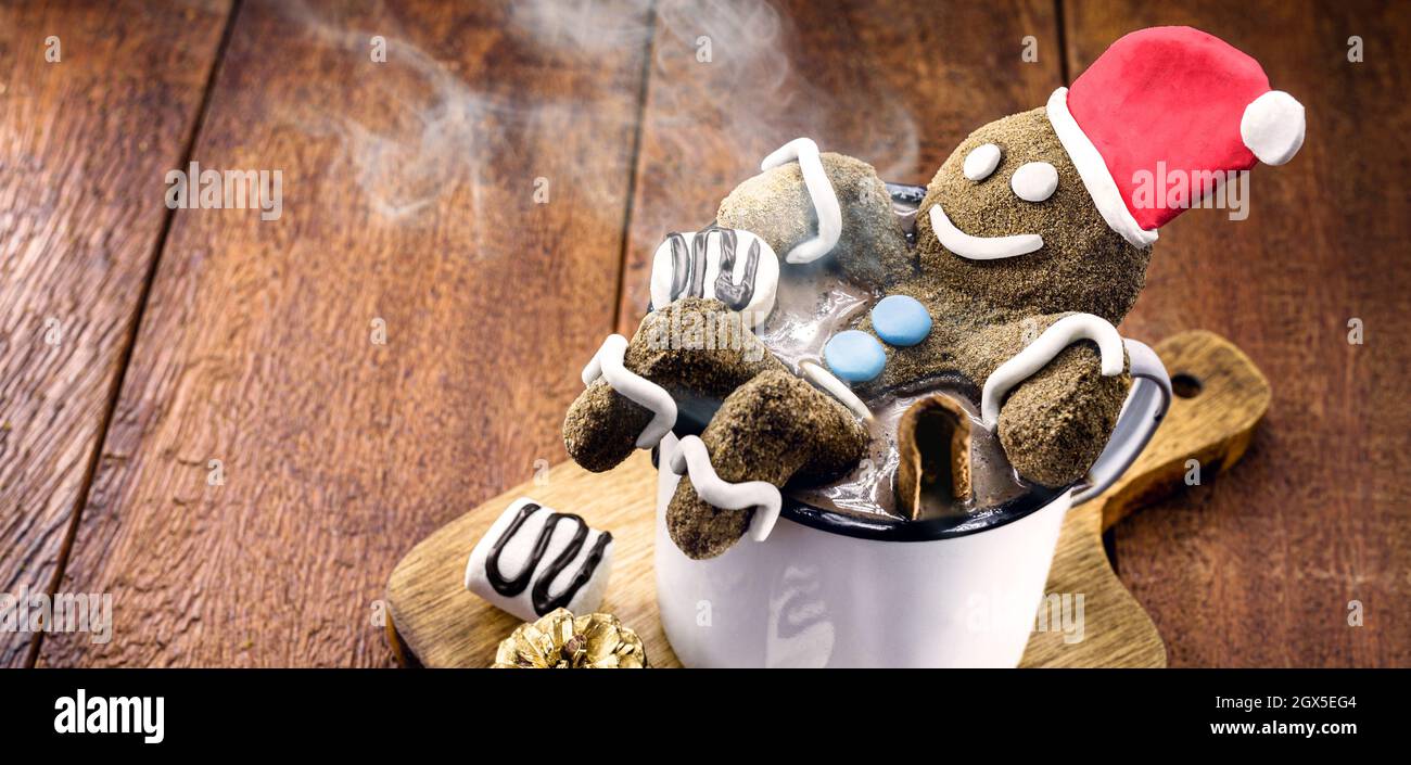 Christmas hot chocolate with marshmallow and gingerbread man biscuit ...