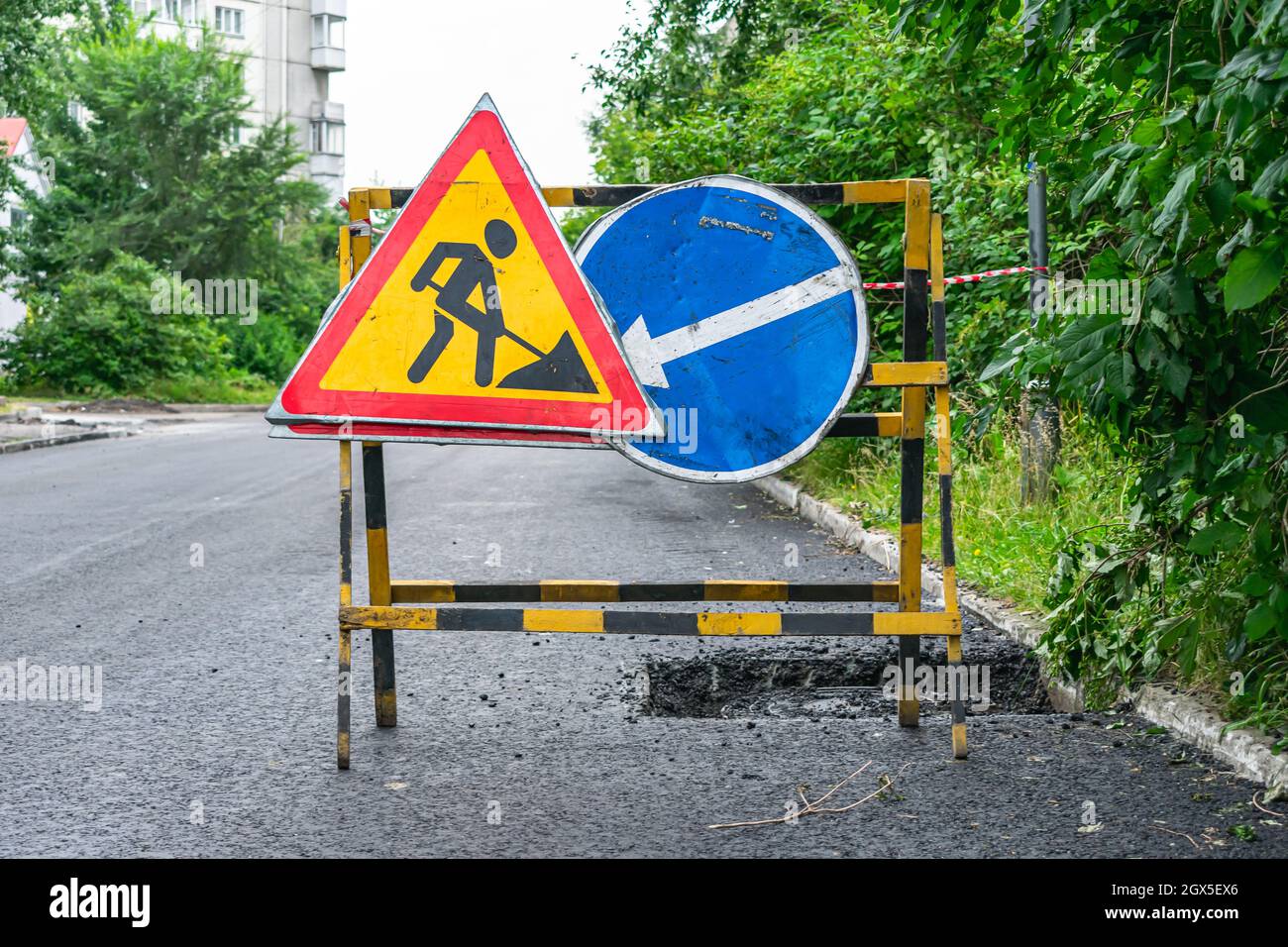 Road signs warning about repair work and laying of new asphalt Stock ...