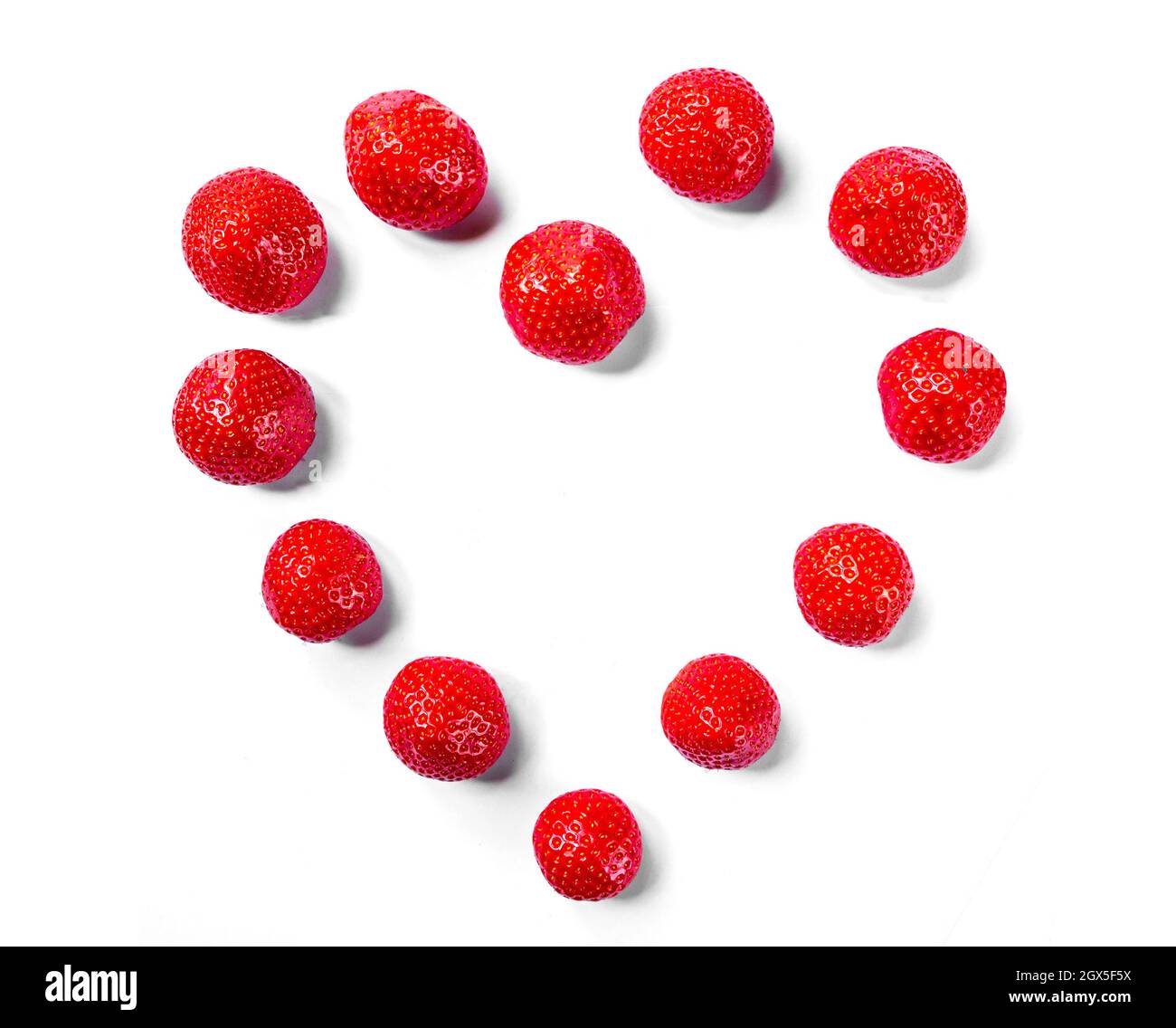 Heart shape made of strawberries. Isolated on white background Stock ...