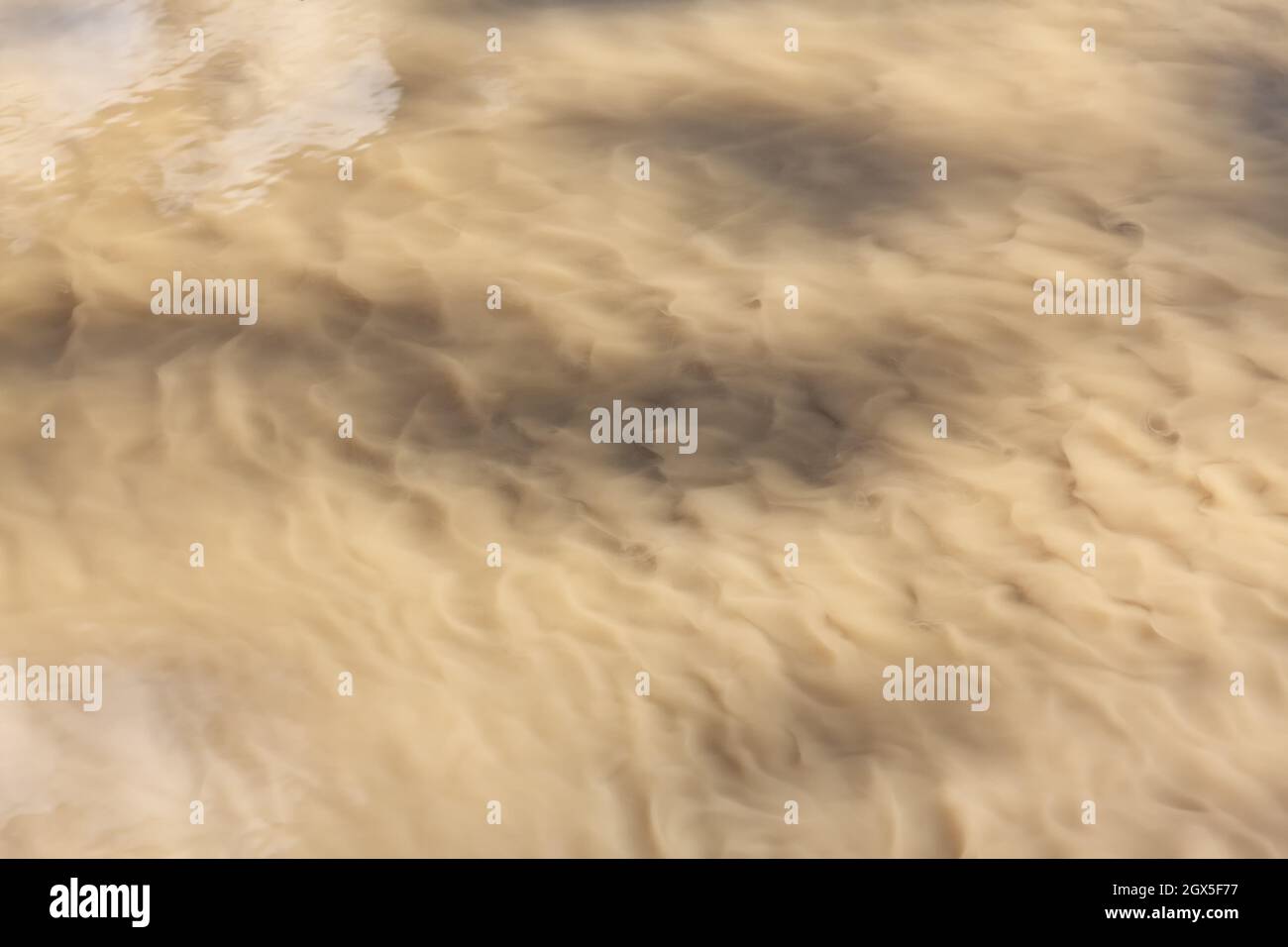 Flowing muddy water background . Ripples on the water surface Stock ...