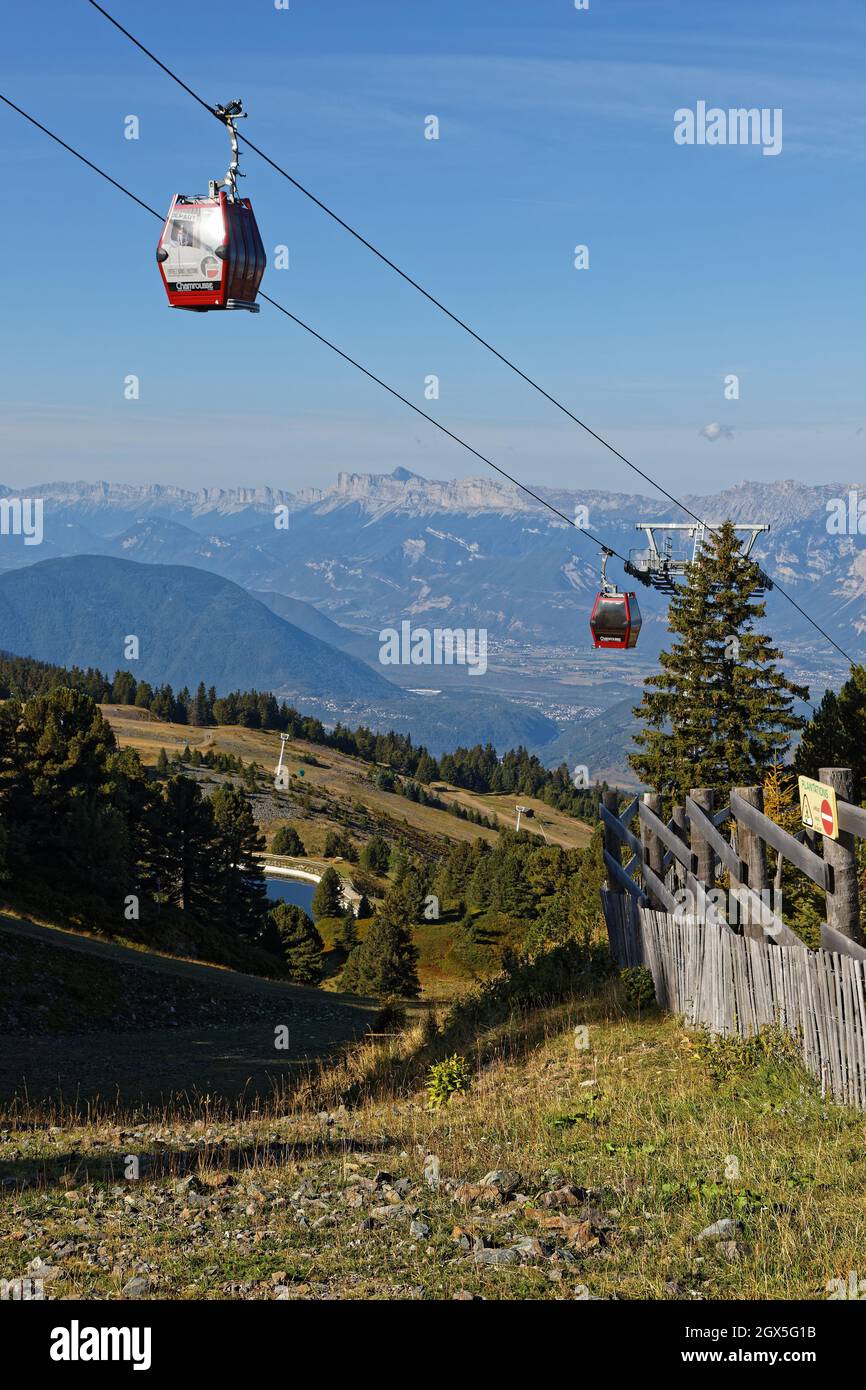 CHAMROUSSE, FRANCE, September 13, 2021 : Red cabins of the cable-car of ...