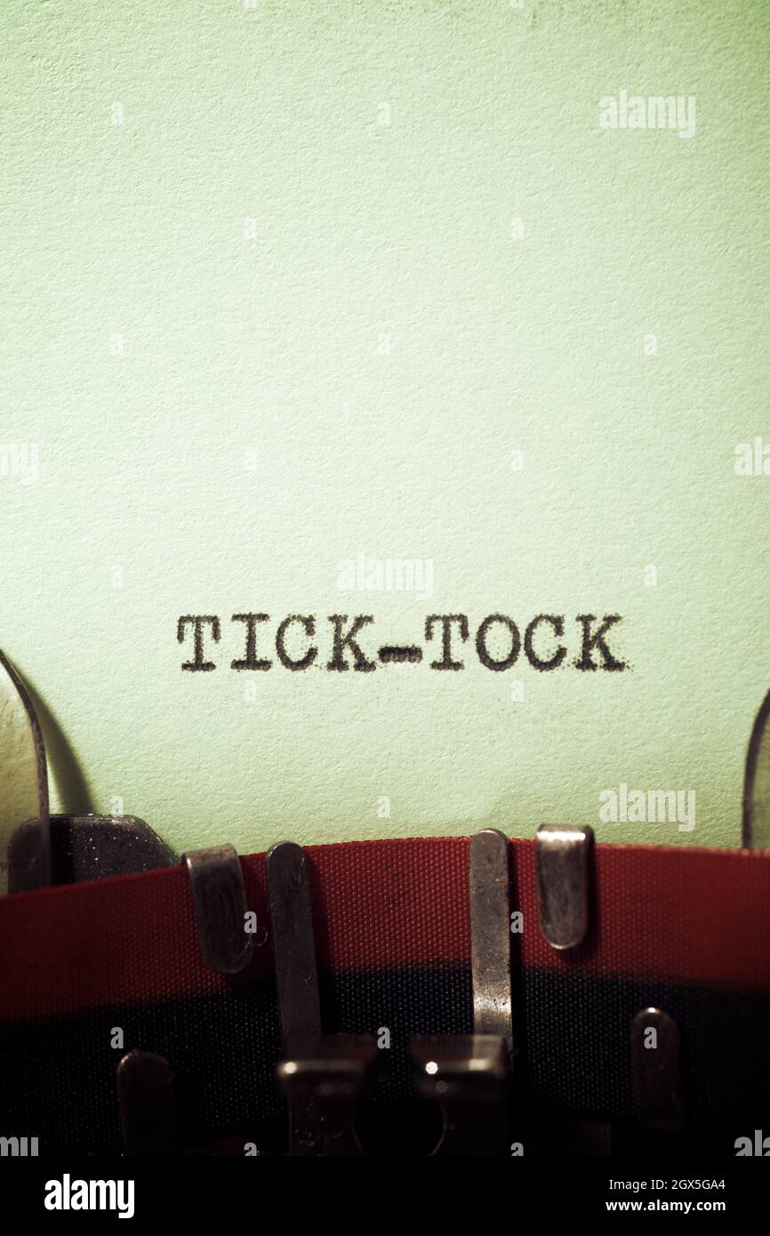 Tick tock text written with a typewriter Stock Photo - Alamy