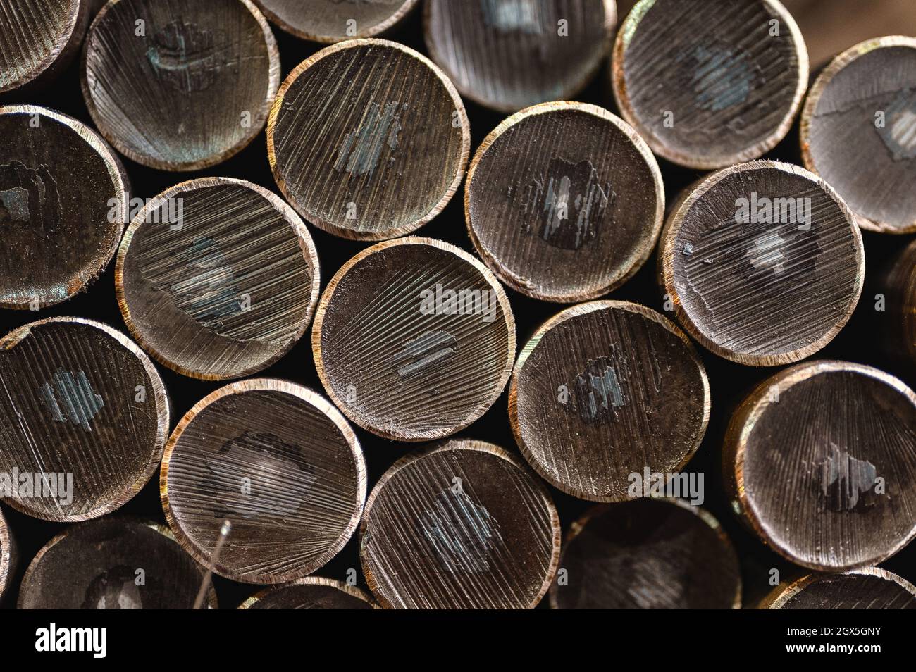 A bundle of round metal bars, steel mill products Stock Photo - Alamy