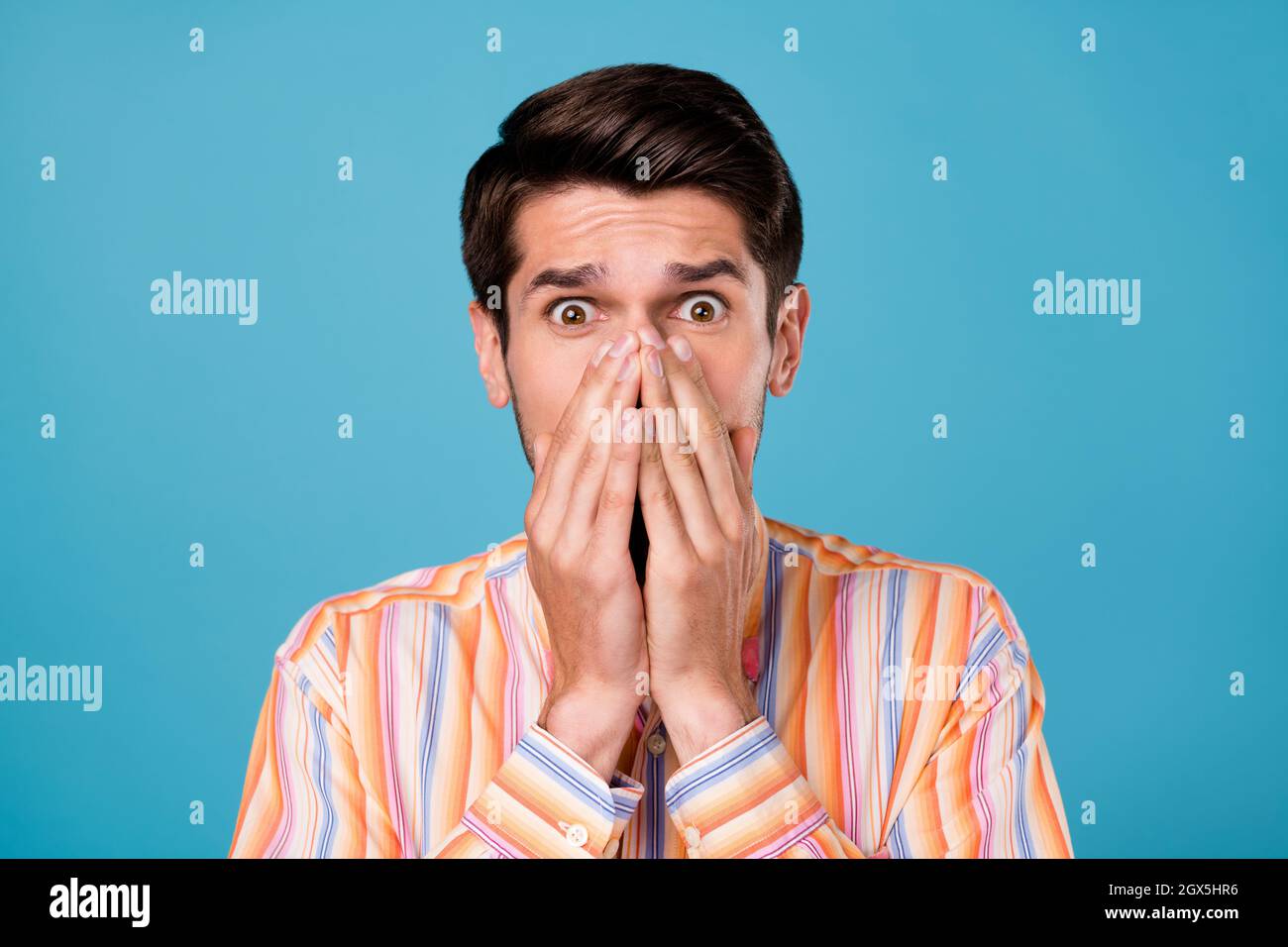 Photo of young man close cover hands face afraid scared worried nervous ...