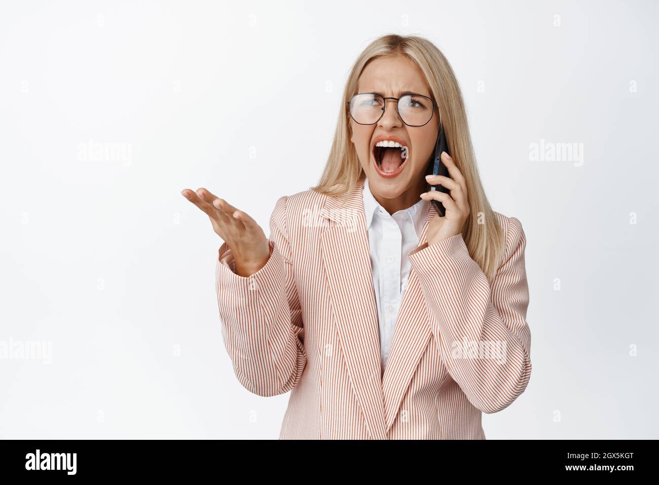Angry office lady shouting, having an argument on phone, screaming and ...