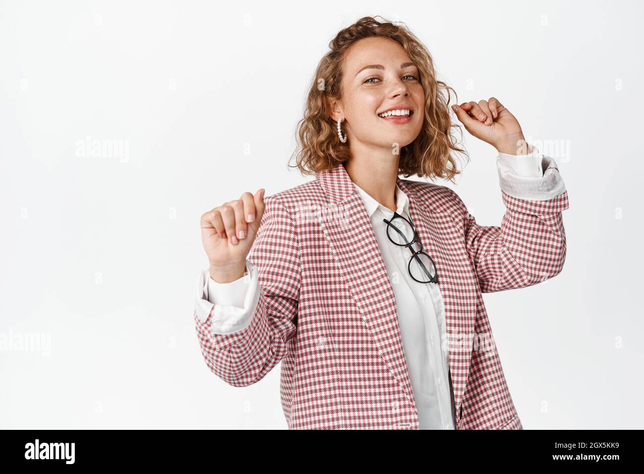 Dancing female entrepreneur smiling, having fun and relaxing, standing ...