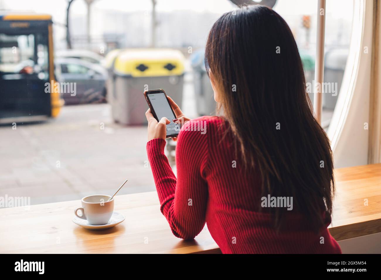 Girl looking her mobile phone Stock Photo - Alamy